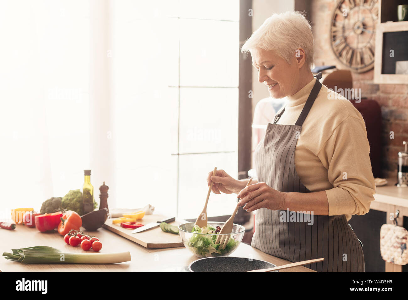 Old lady cooking hi-res stock photography and images - Alamy