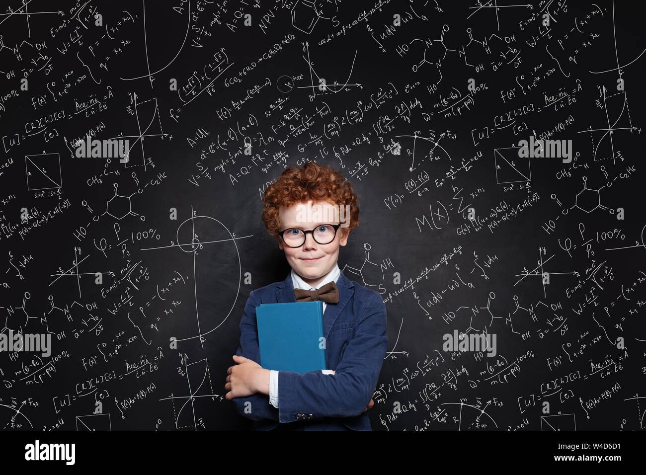 Happy child pupil against science background Stock Photo - Alamy