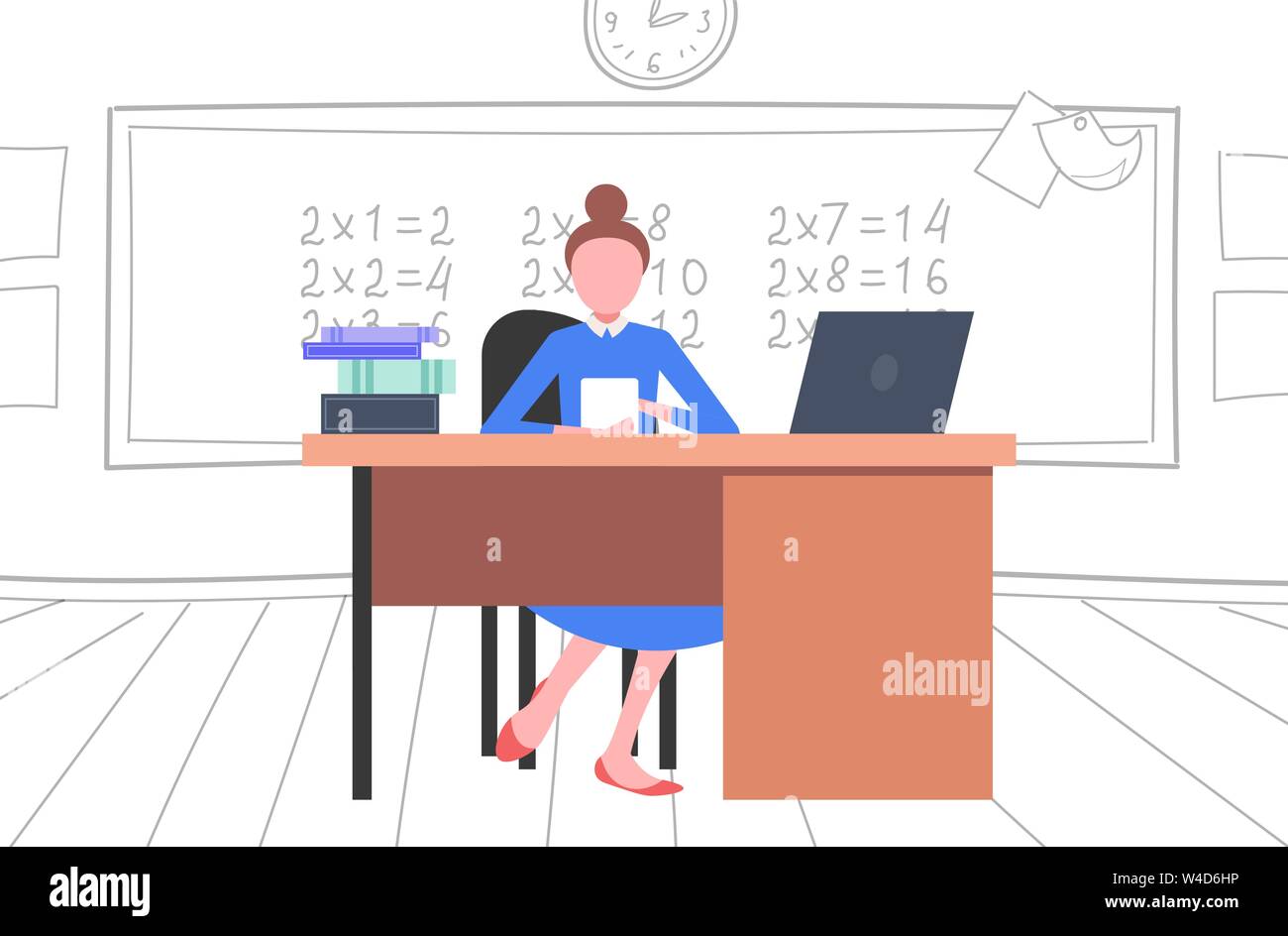 Female Teacher Sitting At Desk In Front Of Chalkboard Using Laptop Math