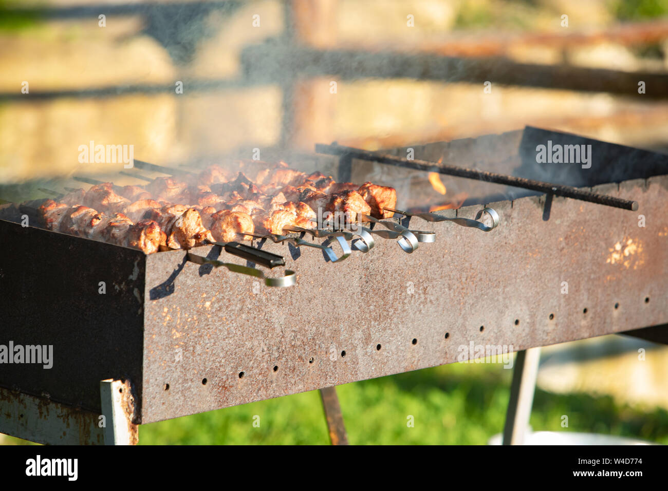 cooking meat at bbq fire close up Stock Photo - Alamy