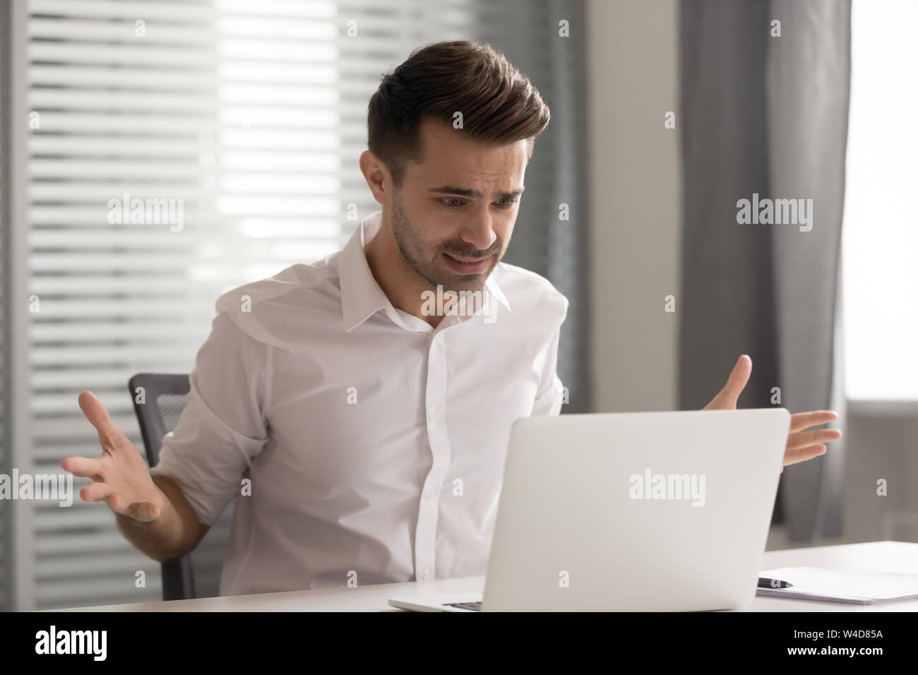 Angry stressed business man annoyed by computer problem in office Stock ...