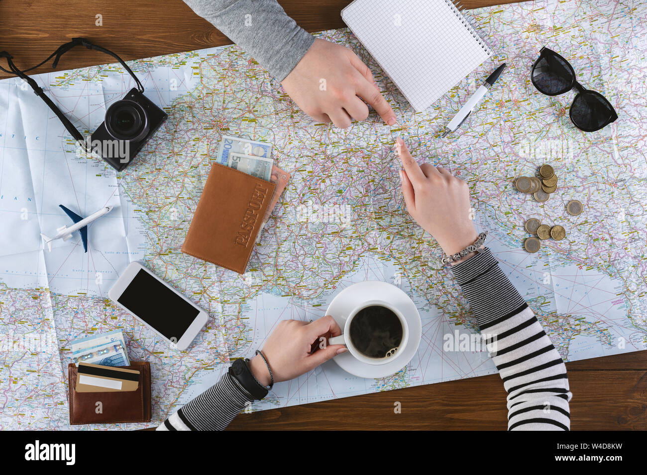 Advanced tourists searching new interesting trip on world map Stock ...