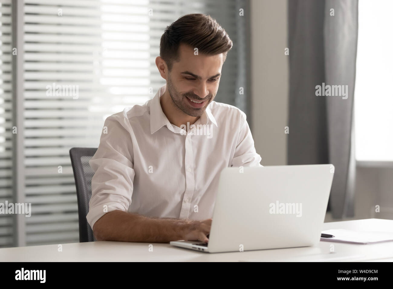 Smiling entrepreneur office desk hi-res stock photography and images ...