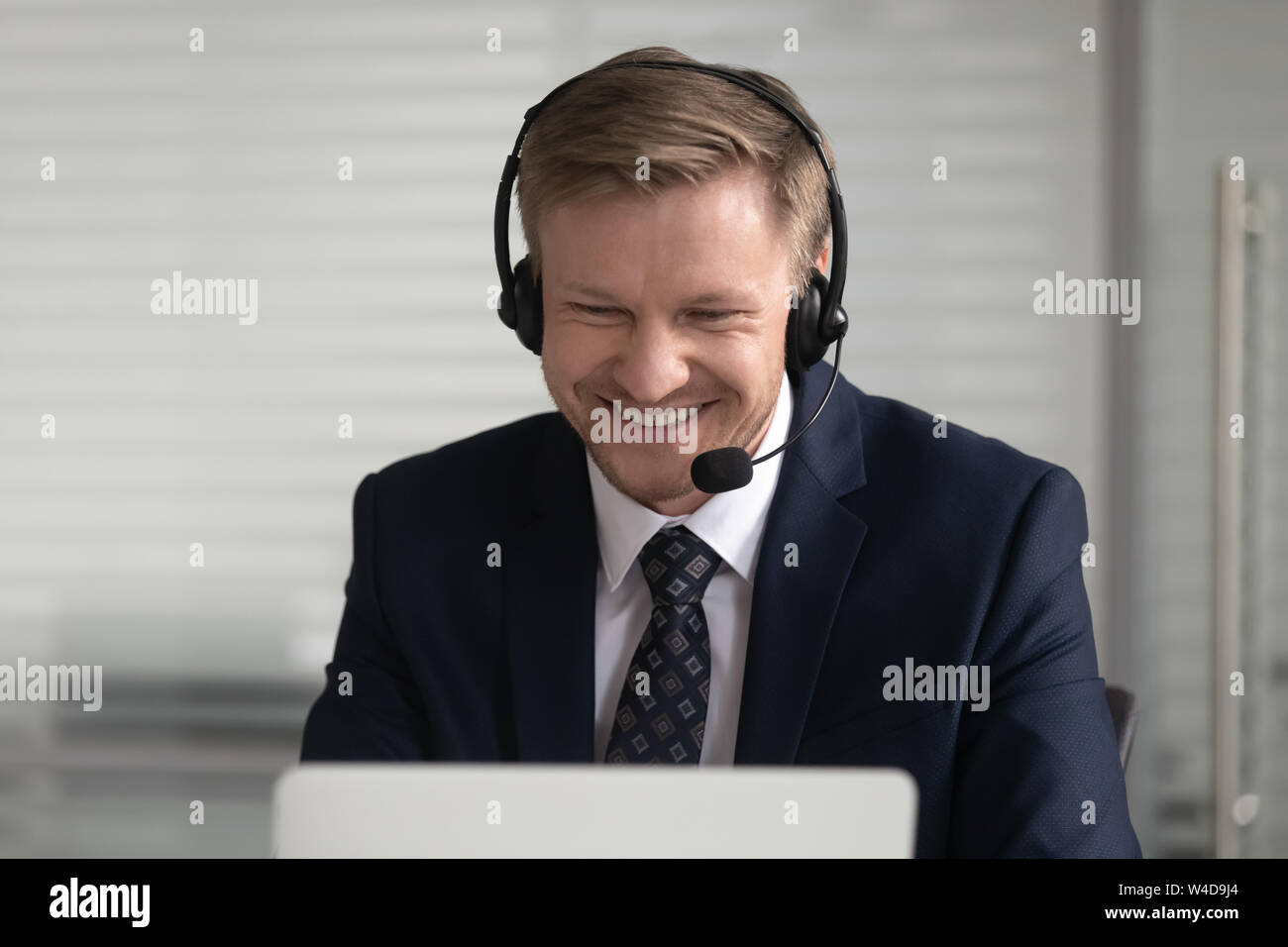 Happy businessman wearing suit wireless headset make conference video ...