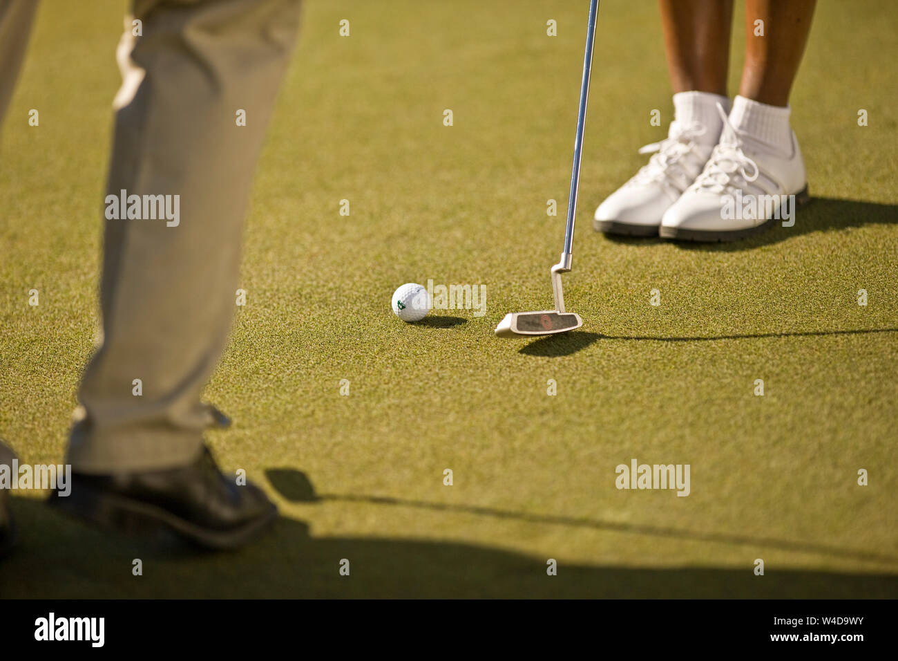 People playing golf Stock Photo - Alamy