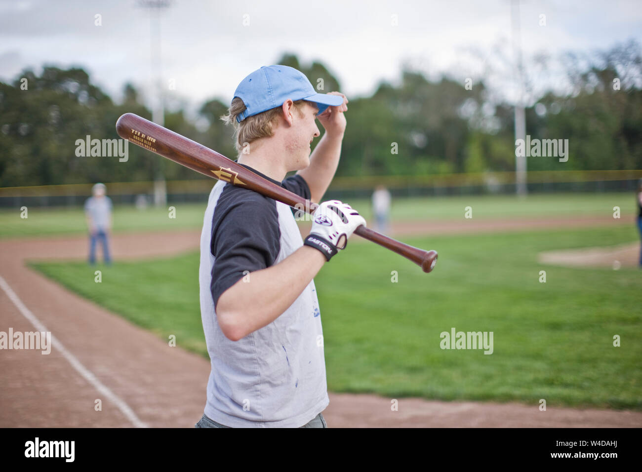 Baseball man bat smile hi-res stock photography and images - Alamy