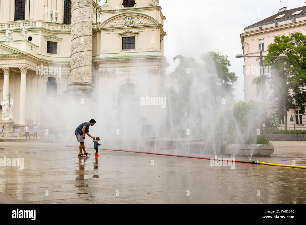 Vienna, Austria - Juli 21, 2019. Water mist and shower spray of water ...