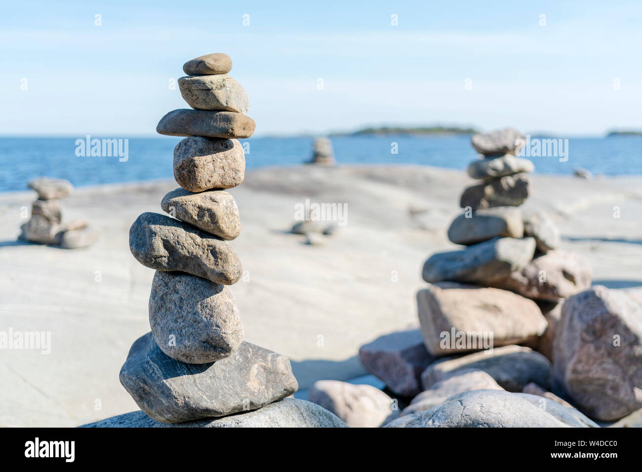 Stacked Rocks balancing, stacking with precision. Stone tower on the ...