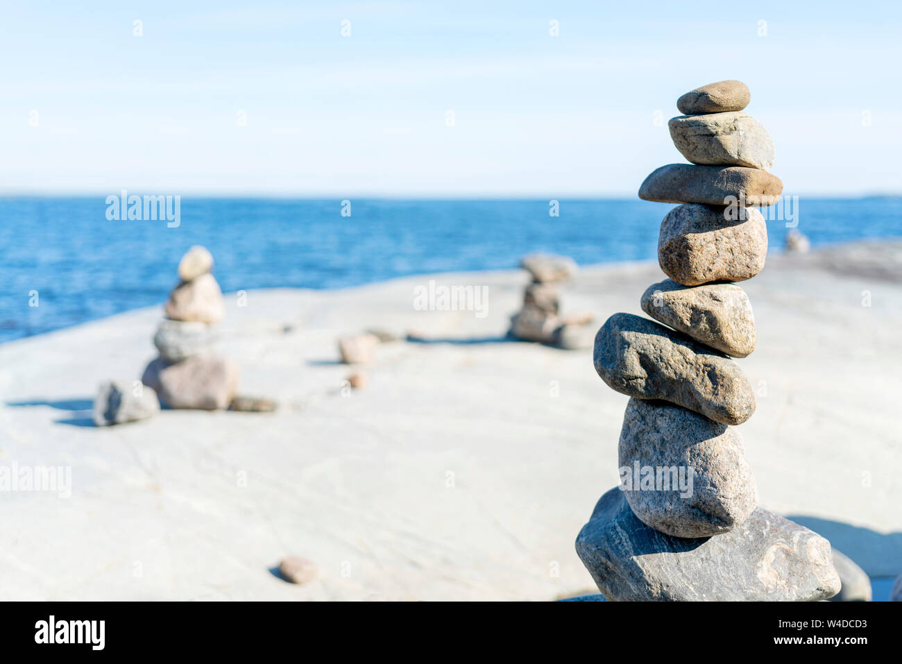 Stacked Rocks balancing, stacking with precision. Stone tower on the ...