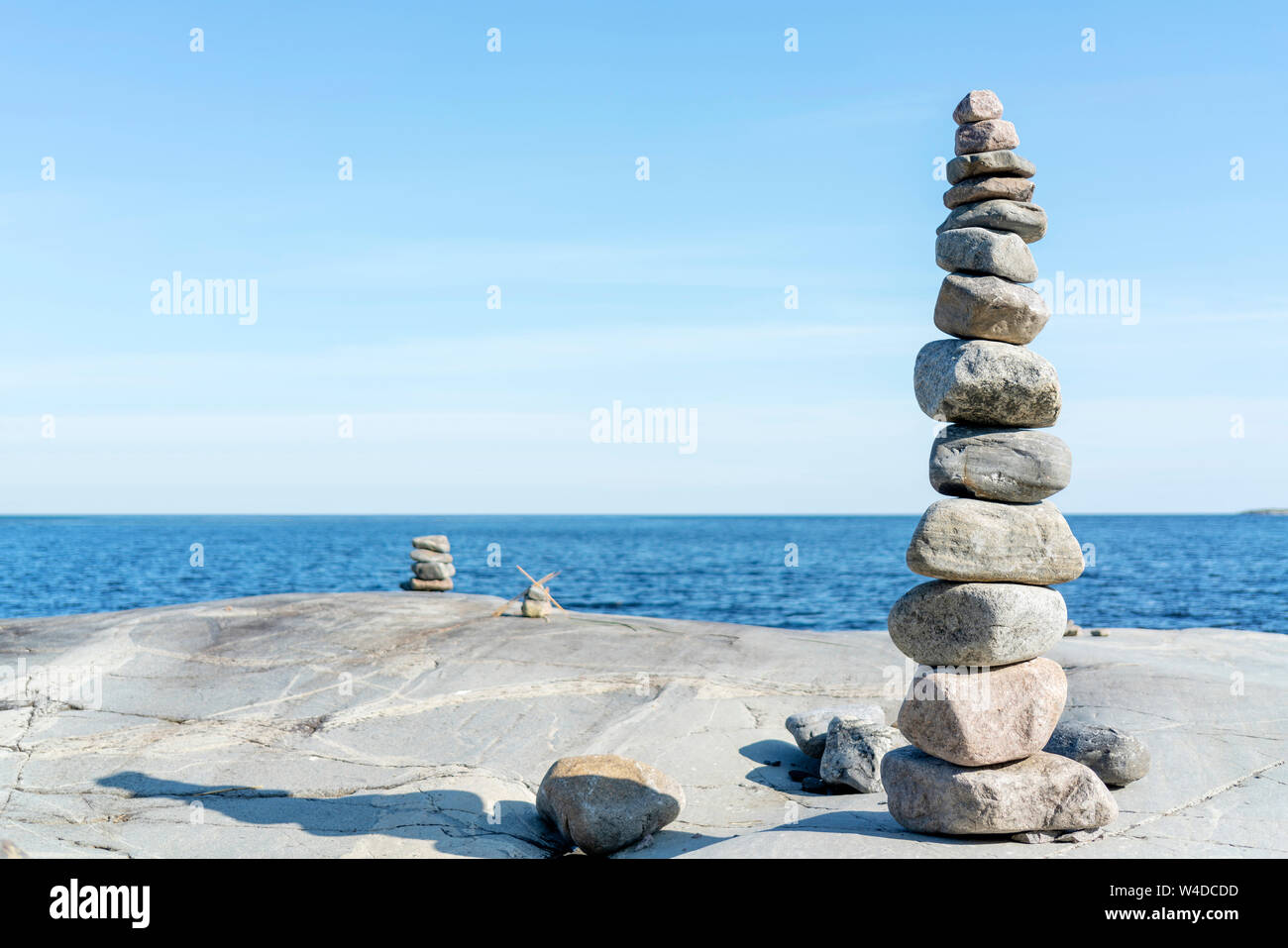 Stacked Rocks balancing, stacking with precision. Stone tower on the ...