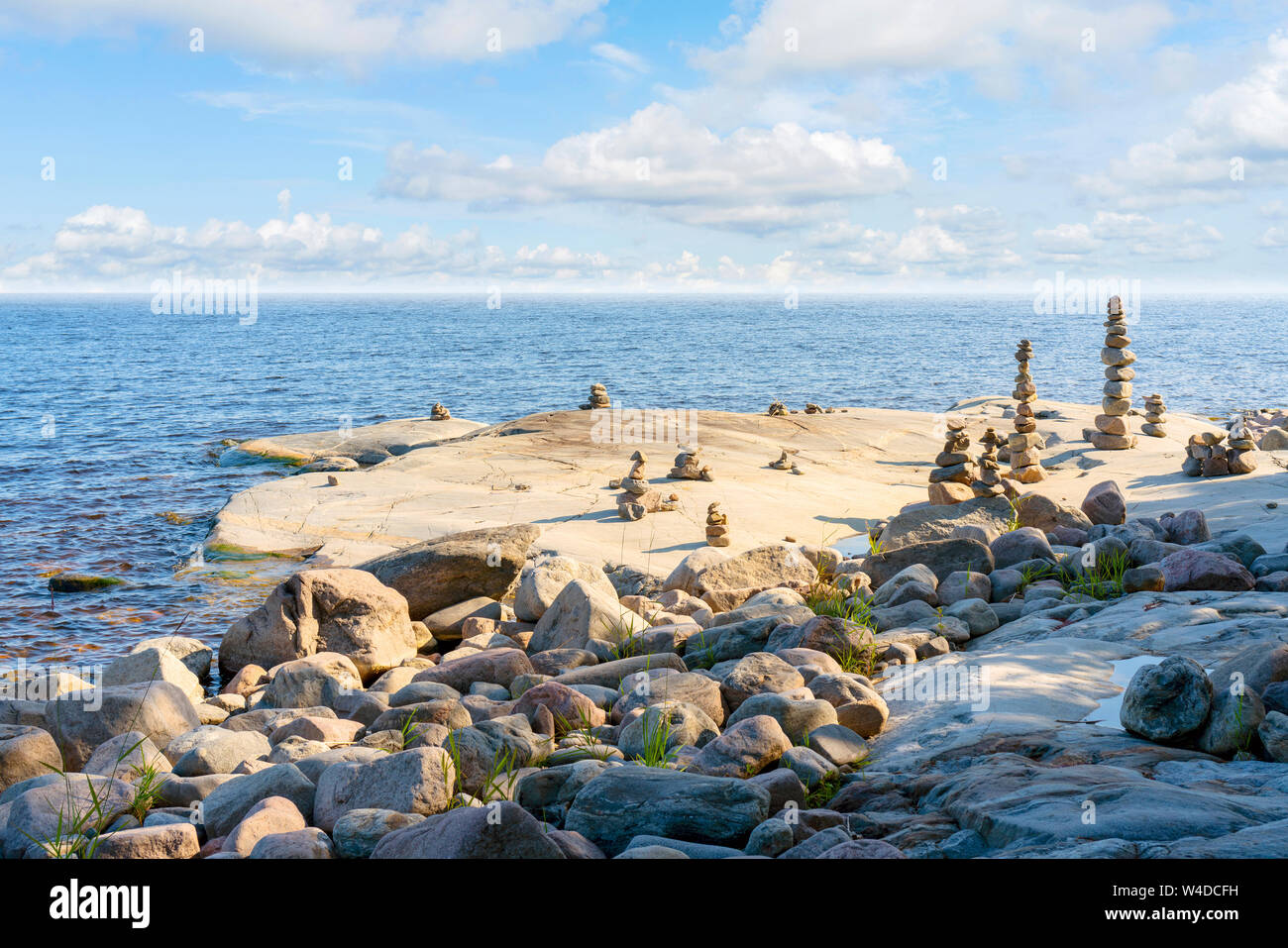 Stacked Rocks balancing, stacking with precision. Stone tower on the ...