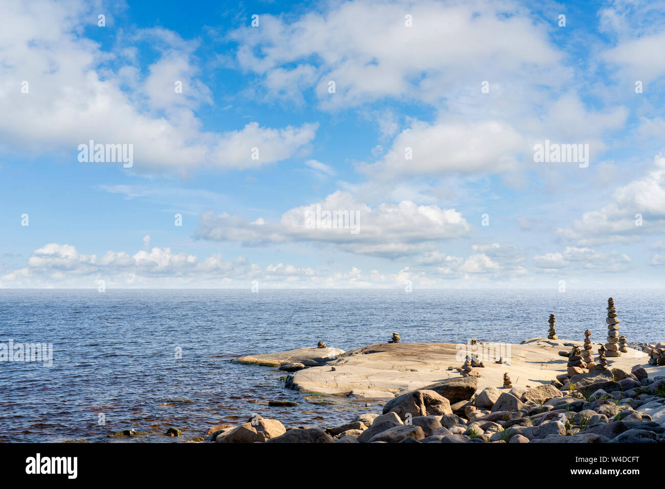 Stacked Rocks balancing, stacking with precision. Stone tower on the ...