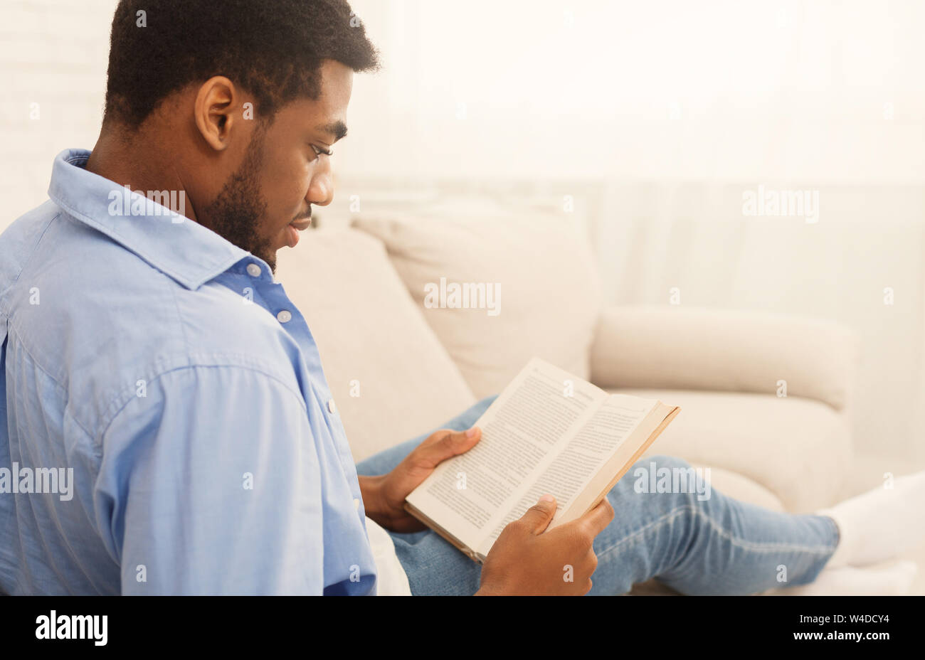 Black student reading book school hi-res stock photography and images ...