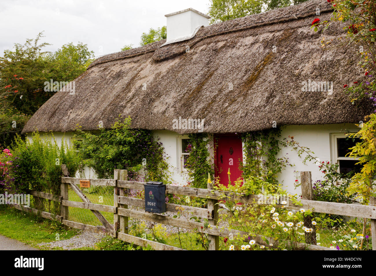 Old traditional irish thatched house on the outskirts of the village of ...