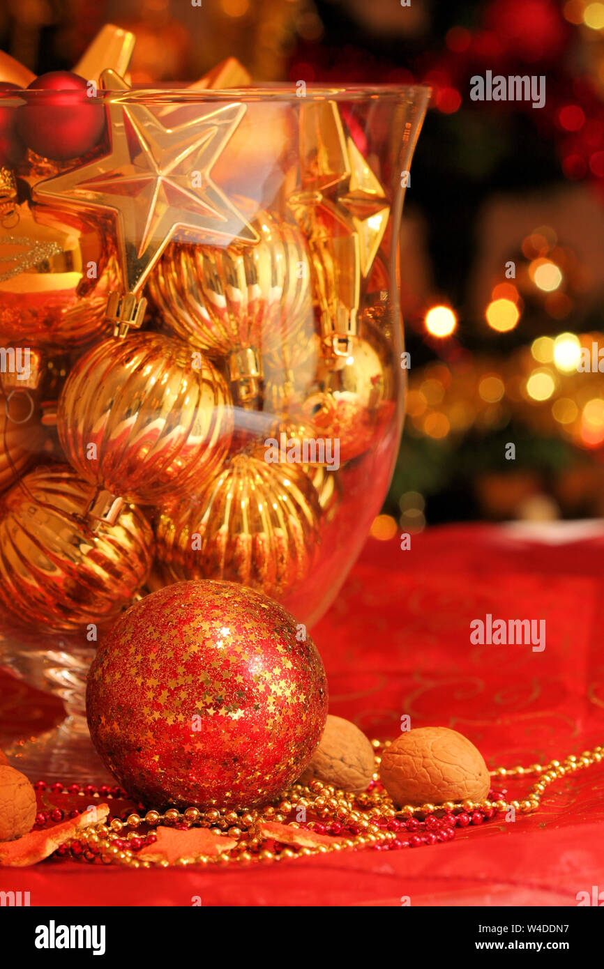 Christmas decoration of table. Christmas tree in background Stock Photo ...