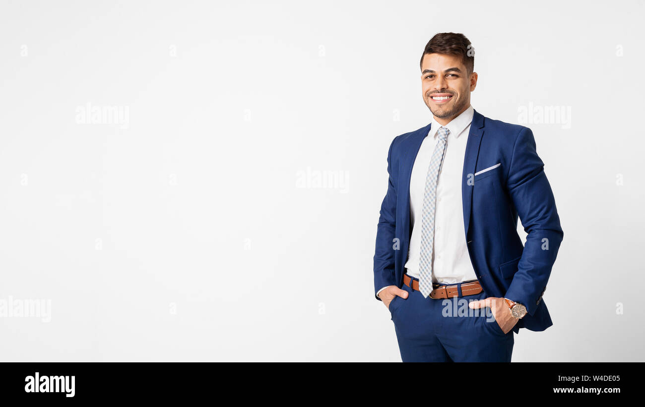 Friendly Businessman Smiling On White Studio Background, Copy Space ...