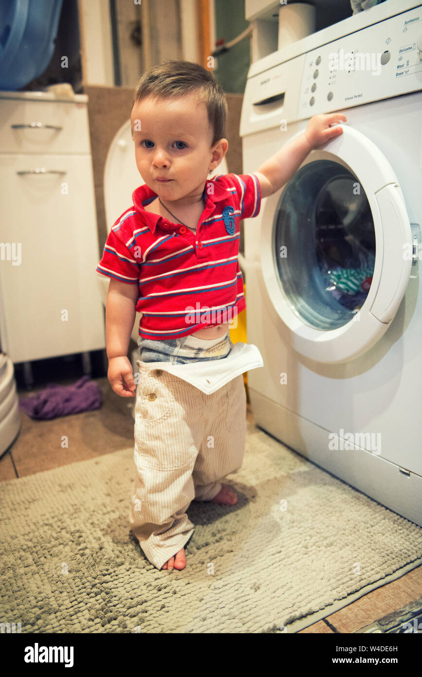 Little helper. Little boy. Wash and go Stock Photo - Alamy