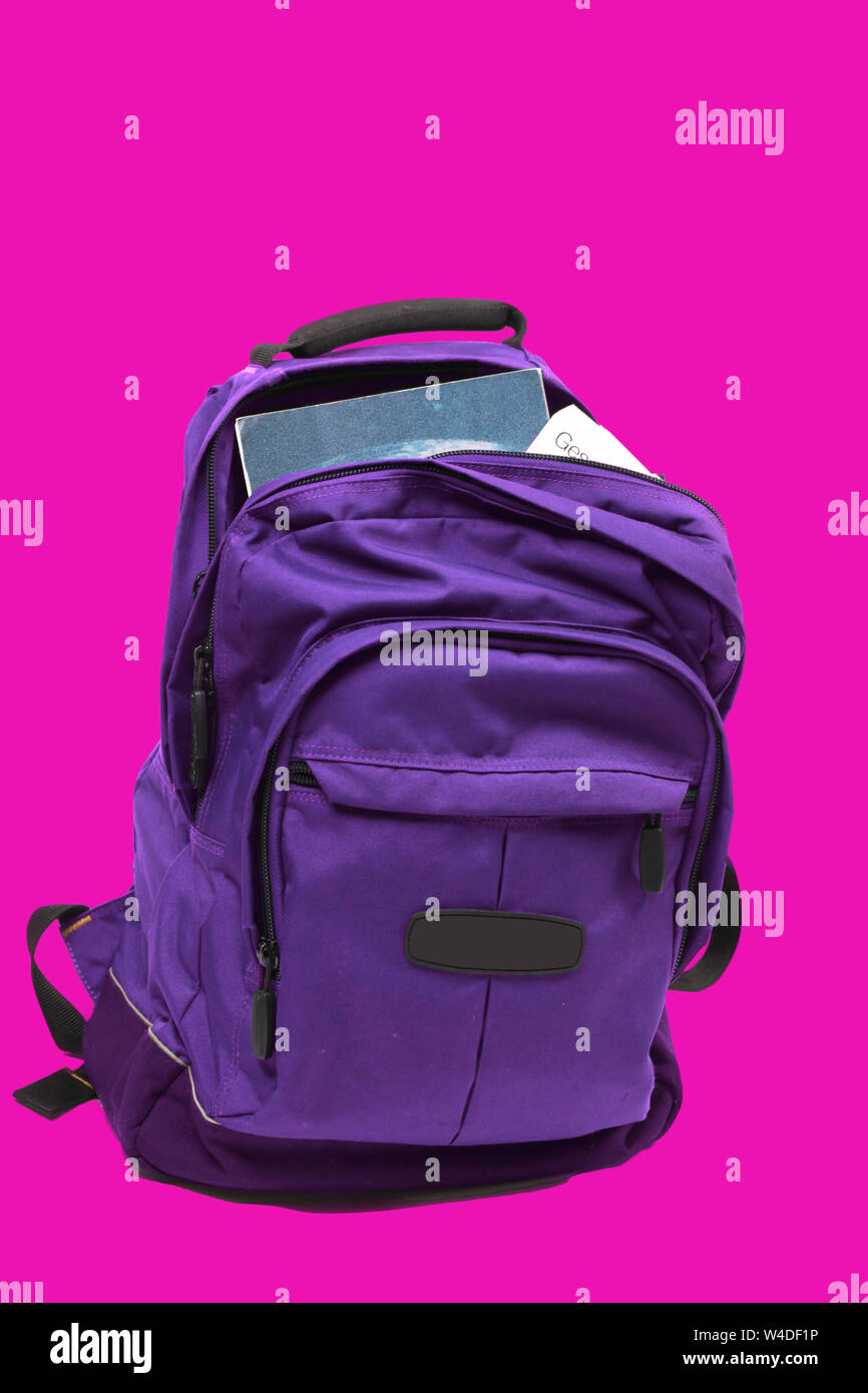 Purple backpack on pink background Stock Photo - Alamy