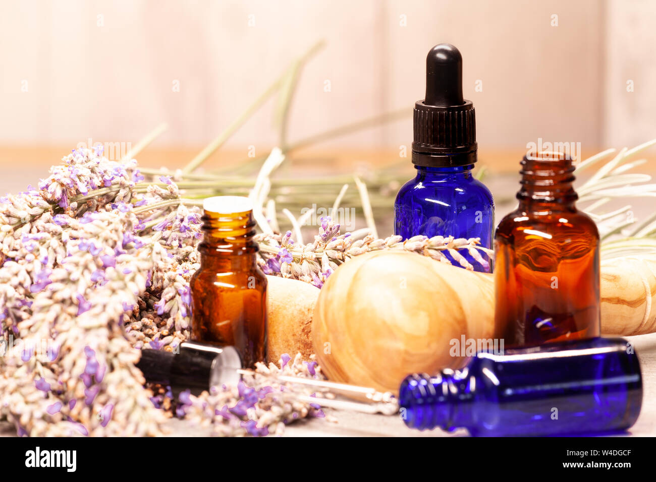 lavender mortar and pestle and bottles of essential oils for aromatherapy Stock Photo - Alamy