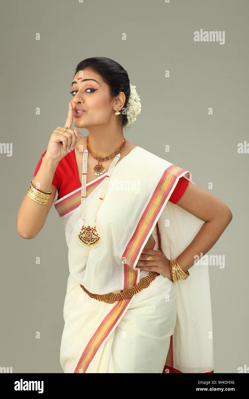 South Indian woman with a finger on lips Stock Photo - Alamy
