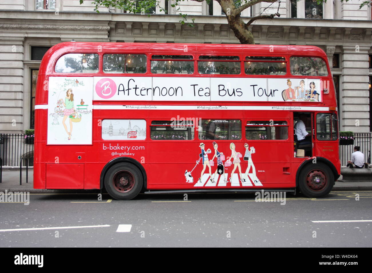 the traditional red double-decker London buses in the traffic on the ...