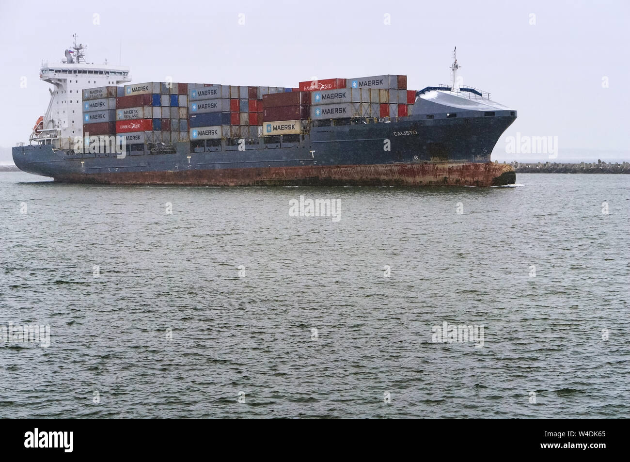 a container ship on the water, a ship carrying containers in winter, 16 ...