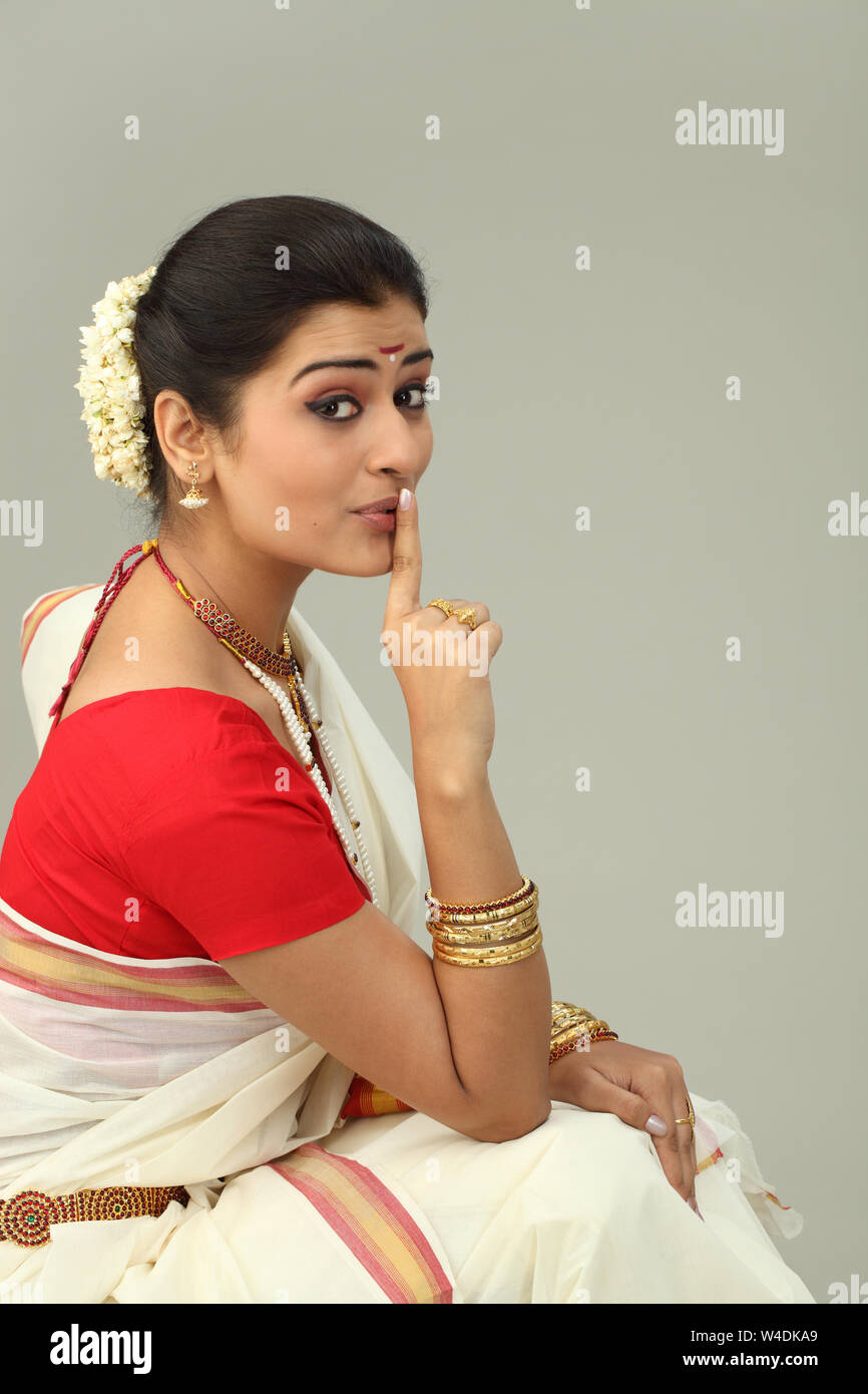 South Indian woman with a finger on lips Stock Photo - Alamy