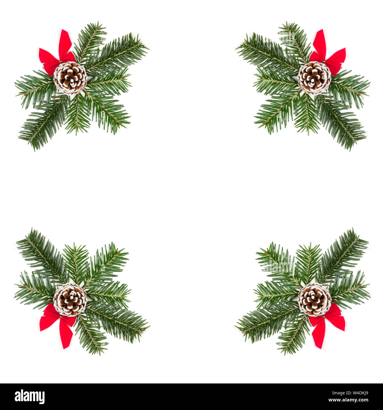 Christmas frame of fir branches of red bow and pine cone isolated on a ...