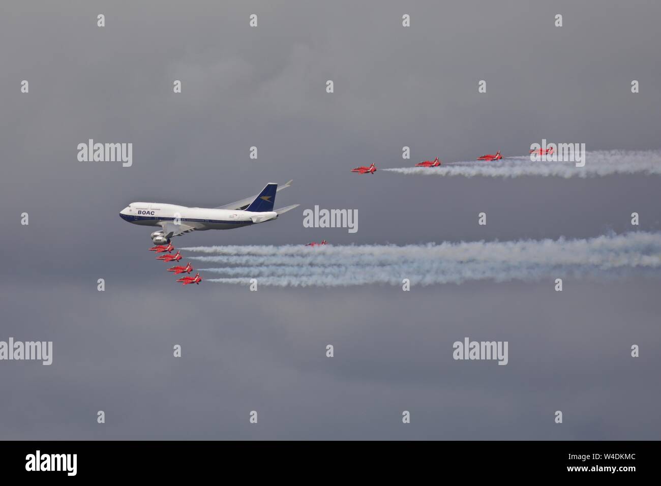 British Airways Boeing 747 and the Red Arrows performing a special ...
