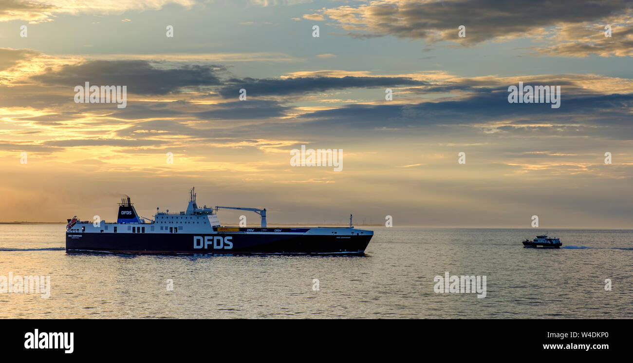 DFDS vessel ARK GERMANIA, leaving the Humber Estuary at sunset, England ...