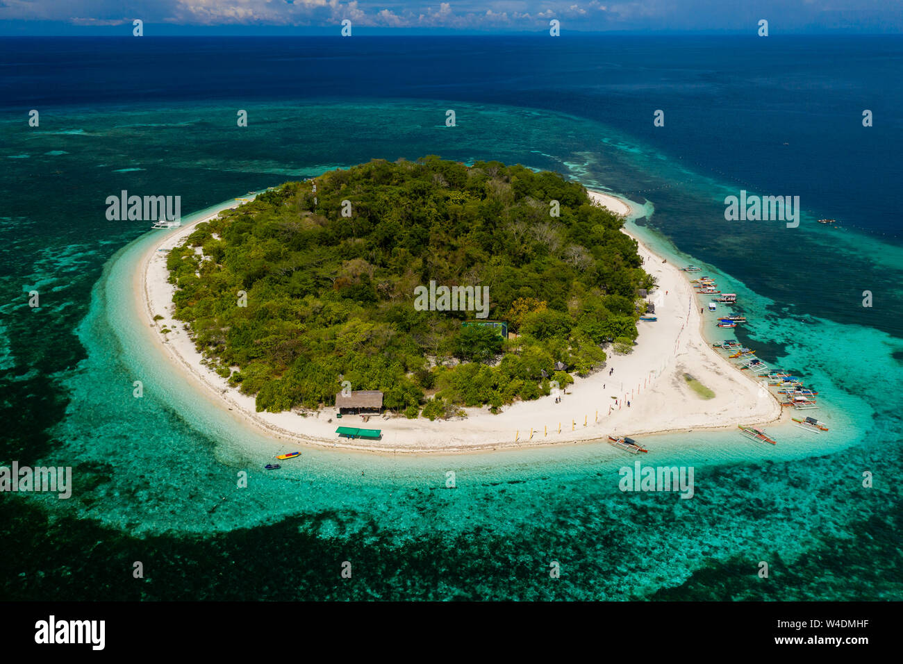 Aerial view of a beautiful tropical island surrounded by coral reef ...