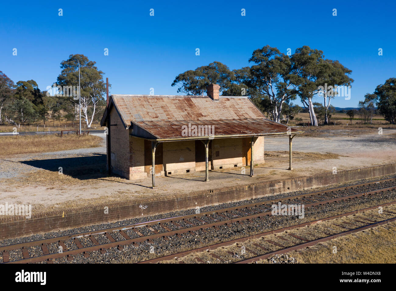 Old train station near a railway track in rural New South Wales ...
