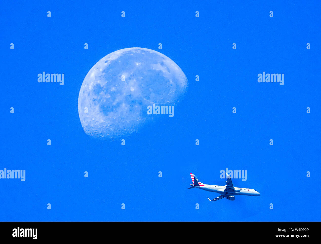 Passing the moon Stock Photo - Alamy
