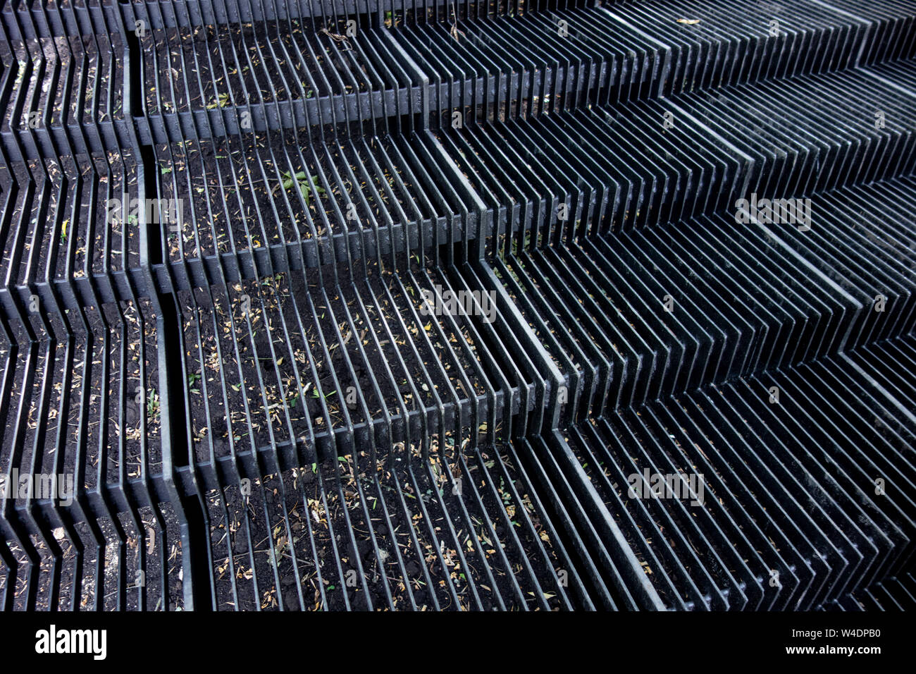 Outside metal stairs framework. Steps from iron straps and gaps ...