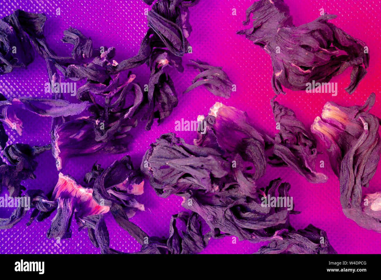 Dried herbal flower particles macro background. Purple and pink colors ...