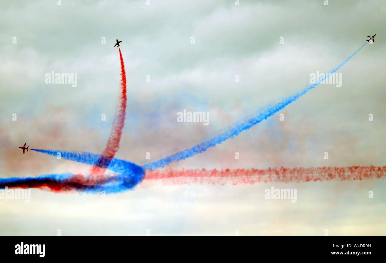 RAF Red Arrows display team aircraft break away leaving colourful red ...