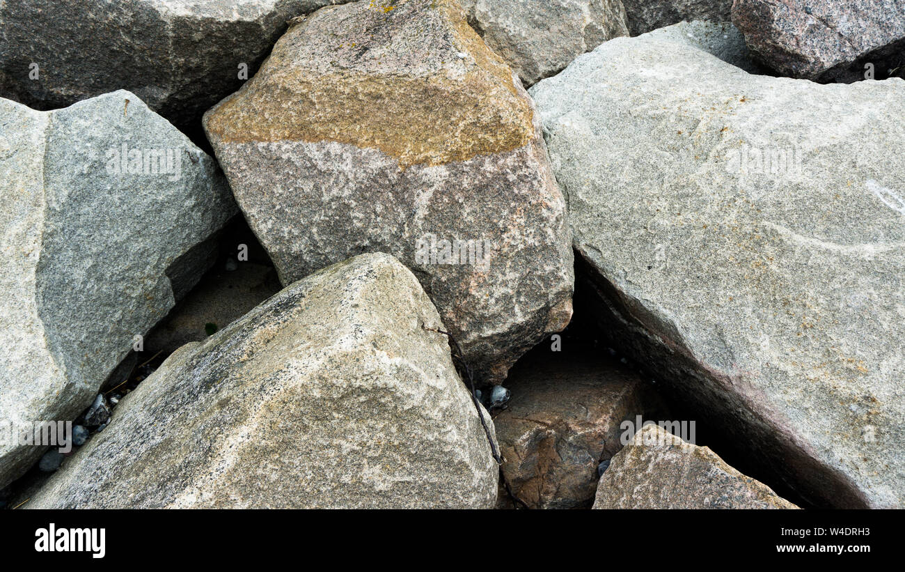 rocks of a harbour breakwater Stock Photo - Alamy