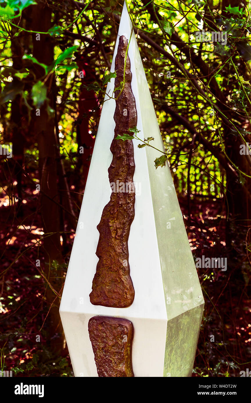 A modern art piece in the shape of a pyramid on display in a sculpture ...