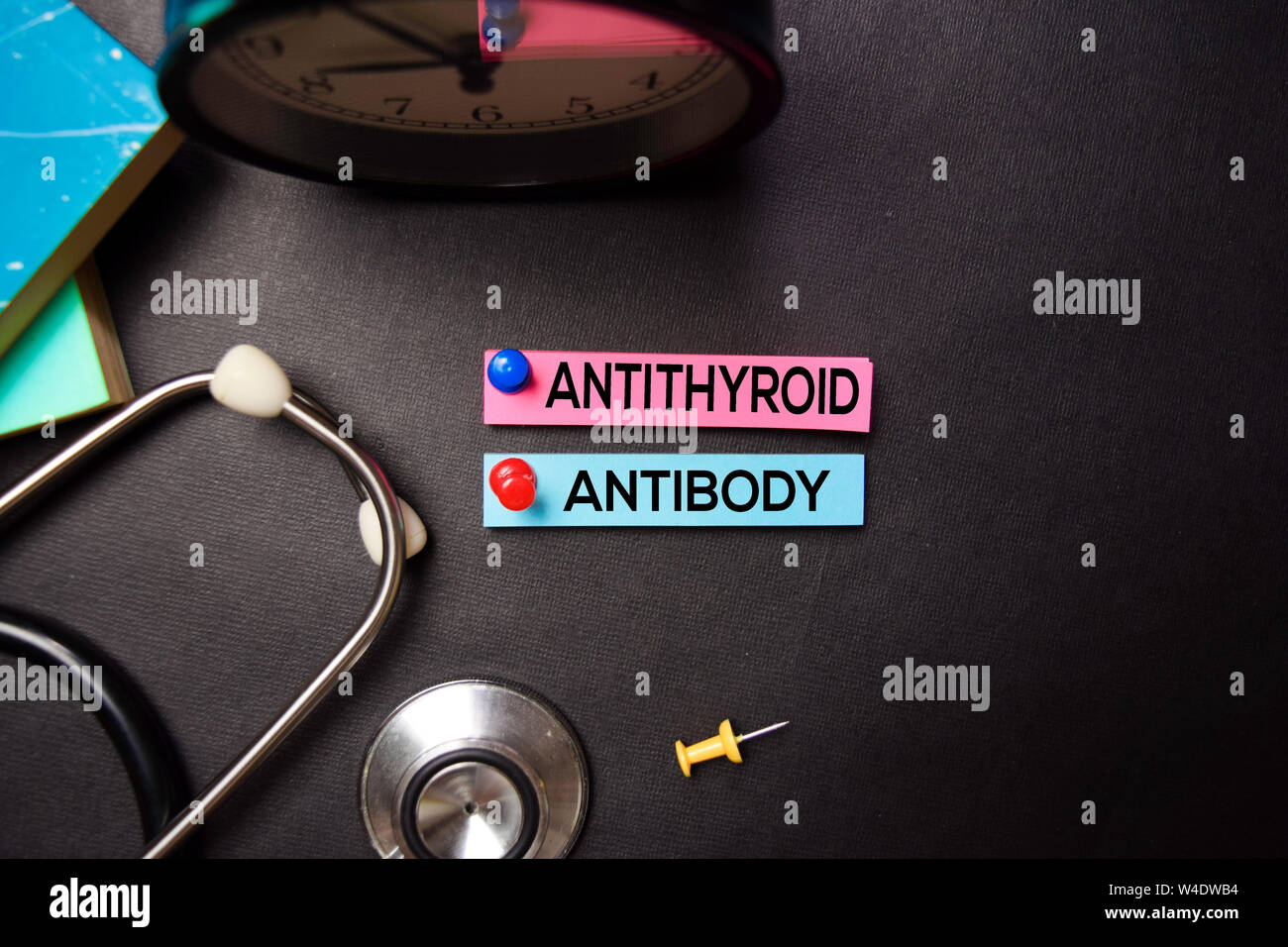 Antithyroid Antibody text on Sticky Notes. Top view isolated on black ...