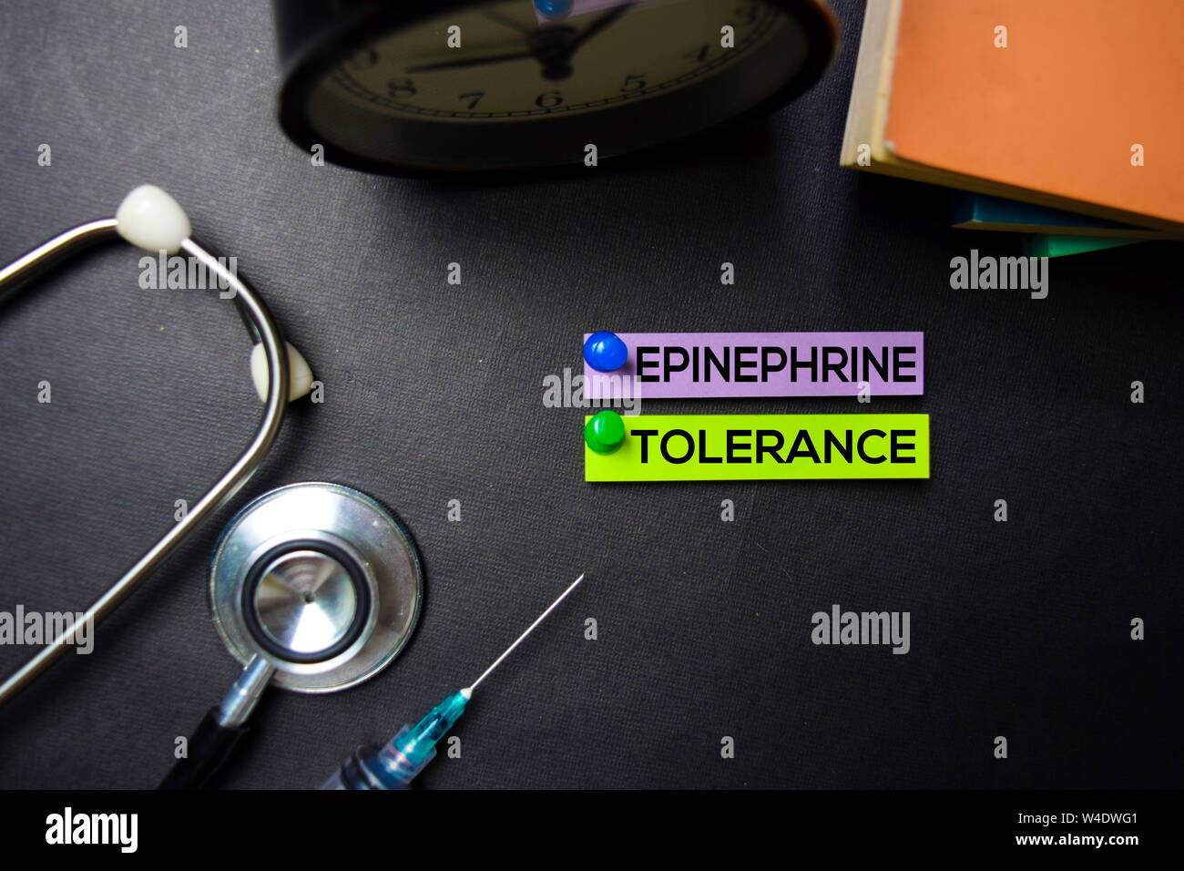 Epinephrine Tolerance text on Sticky Notes. Top view isolated on black ...