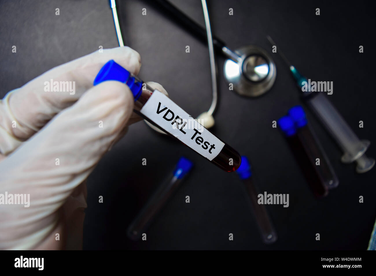 VDRL Test text with blood sample. Top view isolated on black background ...