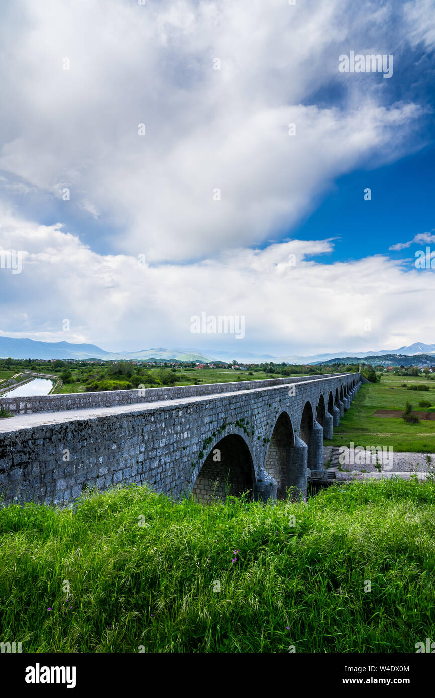 Montenegro, Beautiful emperors bridge building over zeta river water in ...
