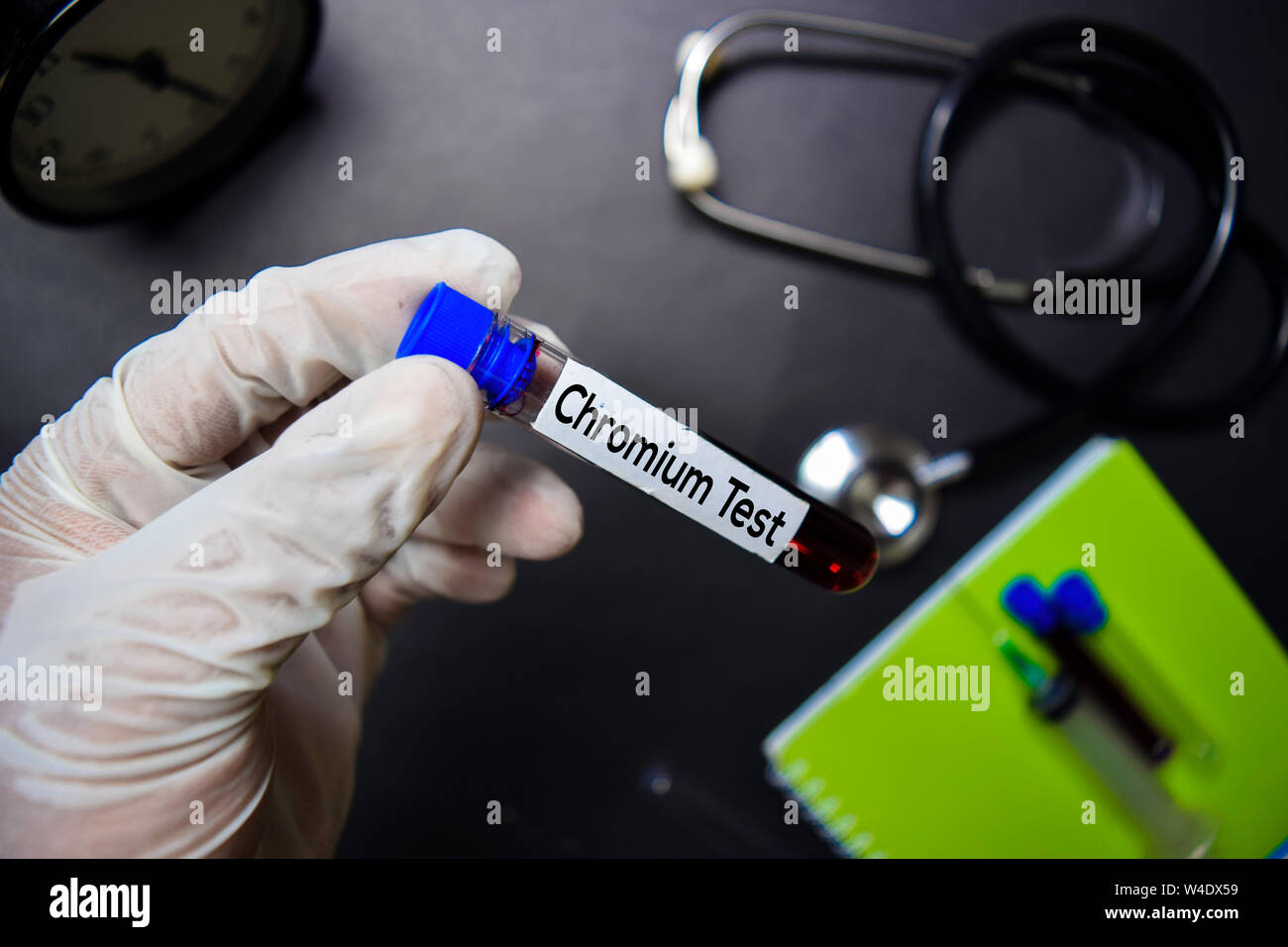 Chromium Test text with blood sample. Top view isolated on black ...