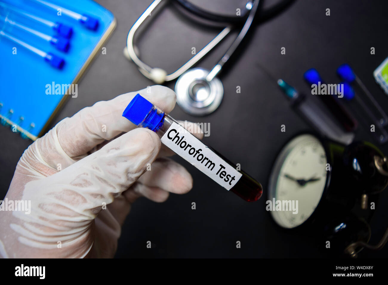 Chloroform Test text with blood sample. Top view isolated on black ...