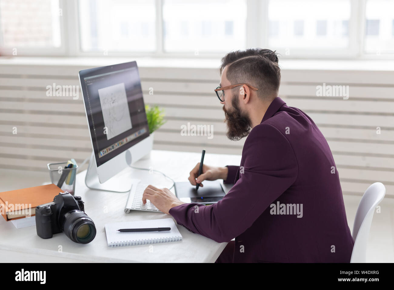 people, design and style concept - graphic designer sketching new ...