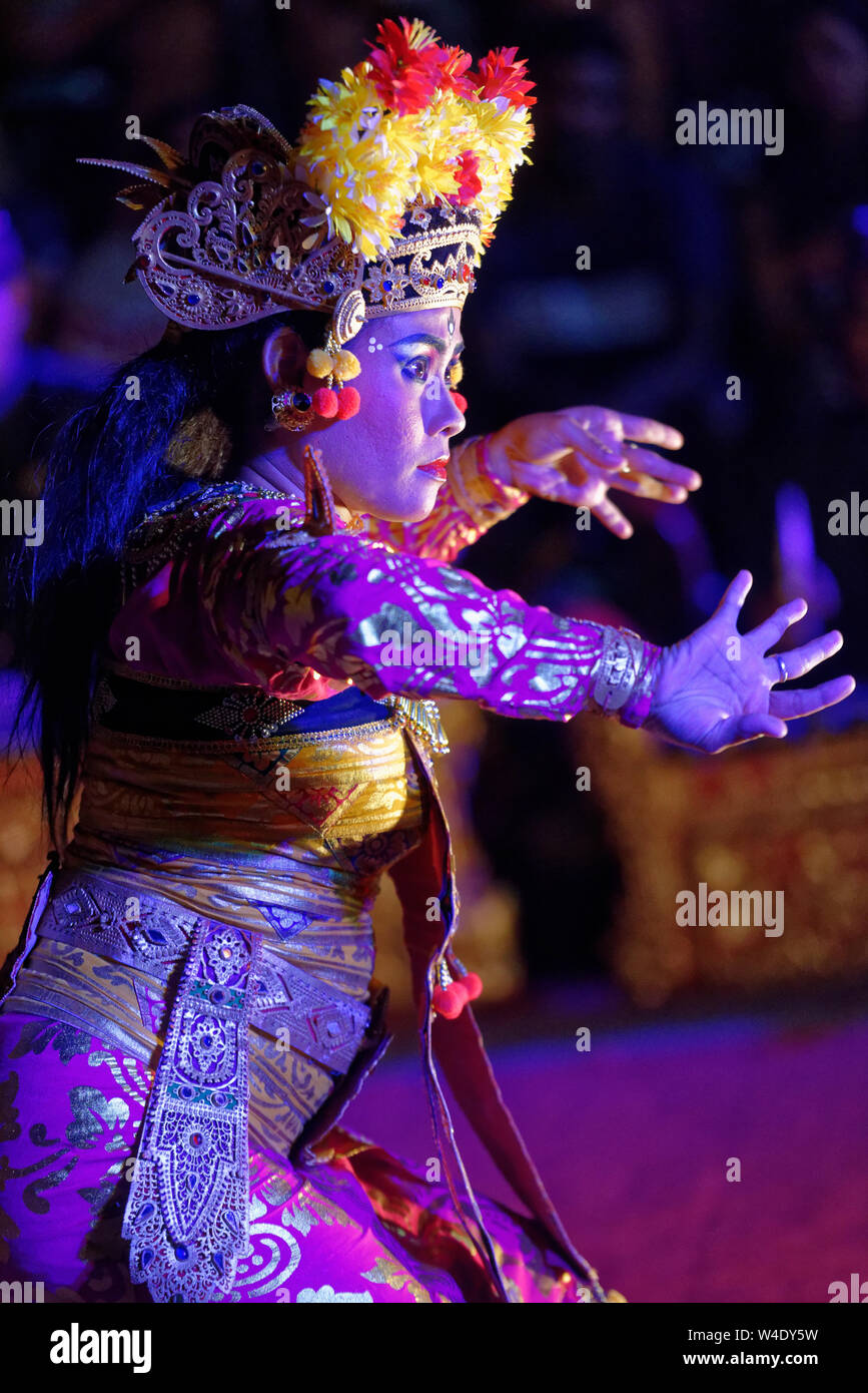 Woman Balinese dancer in traditional dress costume performing in front ...