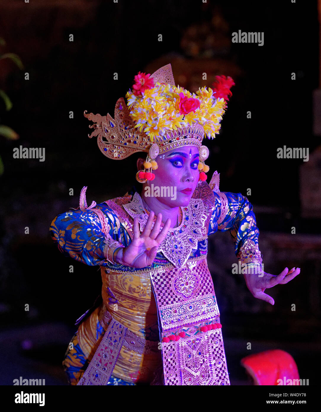 Woman Balinese dancer in traditional dress costume performing in front ...