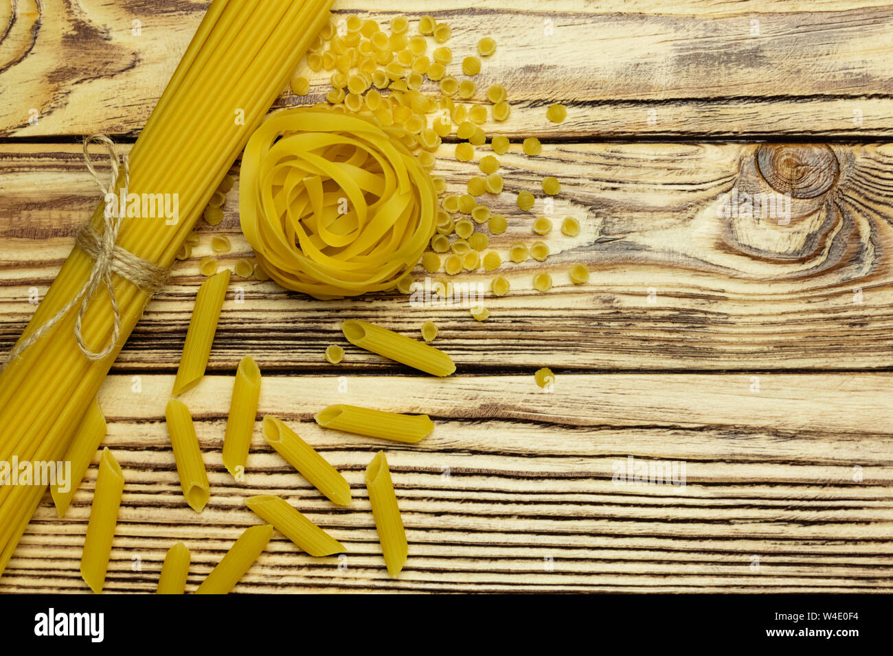 Collection of italian pasta top view on vintage wooden background Stock ...