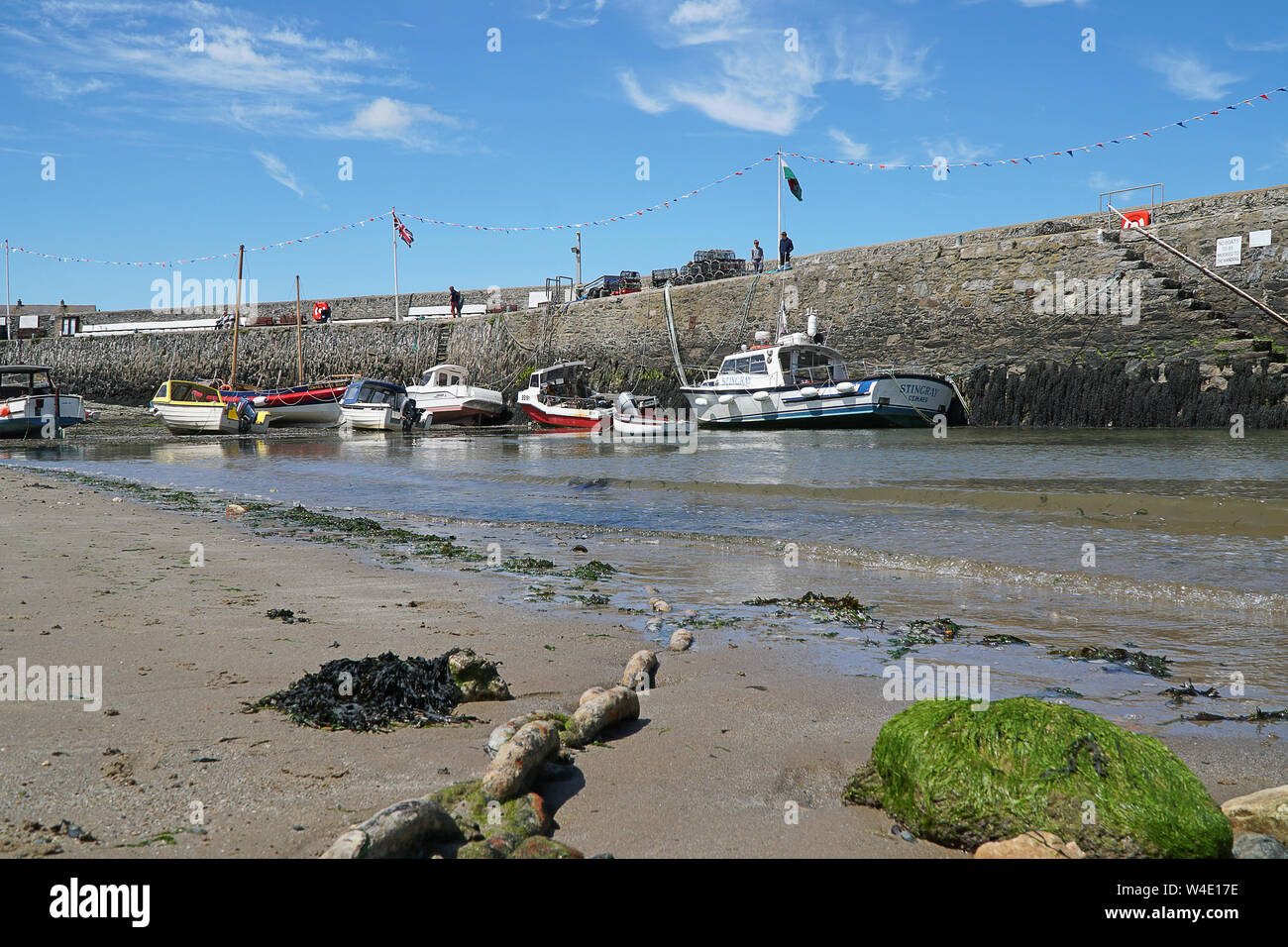 Small boats in the harbour at Cemaes Bay, Anglesey, North Wales, UK ...