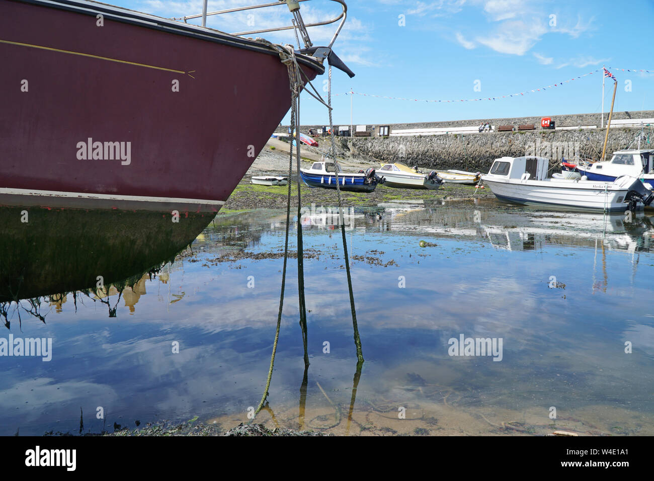 Small boats in the harbour at Cemaes Bay, Anglesey, North Wales, UK ...